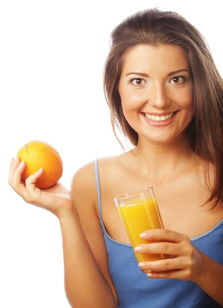 Premium Photo Young Happy Woman Drinking Orange Juice