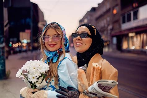 Premium Photo Couple Woman One Wearing A Hijab And A Modern Yet