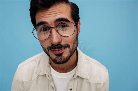 Close Up Portrait Of A Brunette Man Wearing Glasses Smile With Teeth