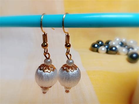 White Silk Thread Small Size Dangle Bead Earing With Metal Cap Kundal