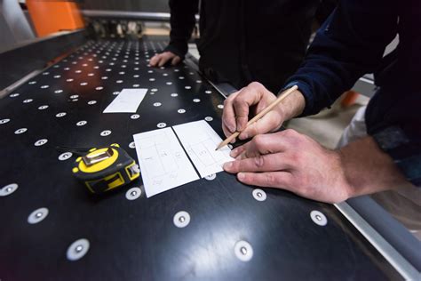 Carpenters Calculating And Programming A Cnc Wood Working Machine