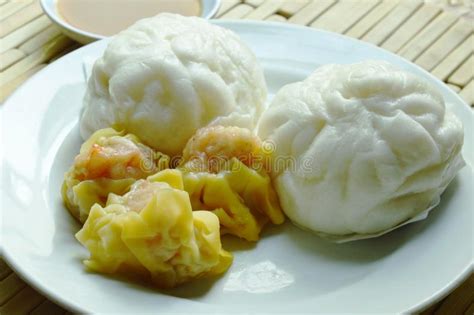 Chinese Steamed Bun Stuffed Minced Pork And Dim Sum With Soy Sauce