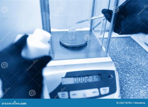 Scientist Weighing Chemicals By Digital Scales In Grams In Chemical Laboratory Blue Toning