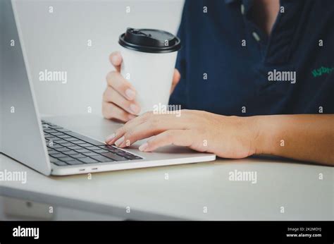 Man Using Computer Laptop And Coffee Cup Paper Searching Internet