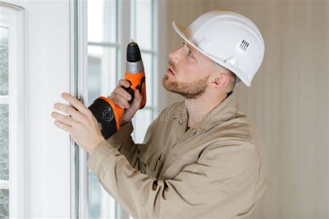 Male Builder Using Cordless Drill Stock Image Image Of Handyman