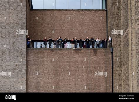 People Looking Across The River Thames From The Outside Viewing Area