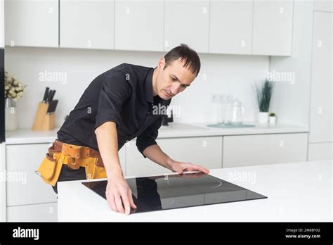 Man Electrical Repairs Kitchen Surface Apartment Installing Hob In Countertop Man Bought New