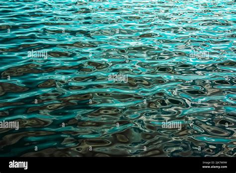 Water Ripple Texture Background Wavy Water Surface During Sunset