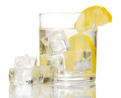 Premium Photo Ice Cubes In Glass With Lemon Isolated On White