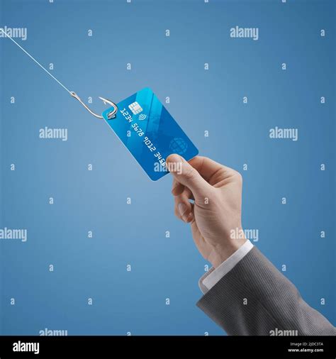 Thief Stealing A Businessmans Credit Card With A Hook Phishing And
