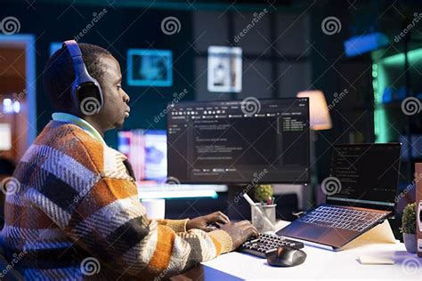 Black Software Engineer Writes Complex Binary Code Scripts On Computer