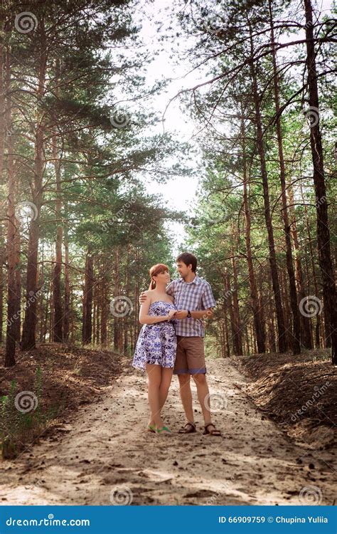 A Young Couple In Love Walking In The Woods Stock Image Image Of Love