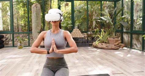 Practicing Yoga With Vr Headset Woman Meditating In Glass House Copy