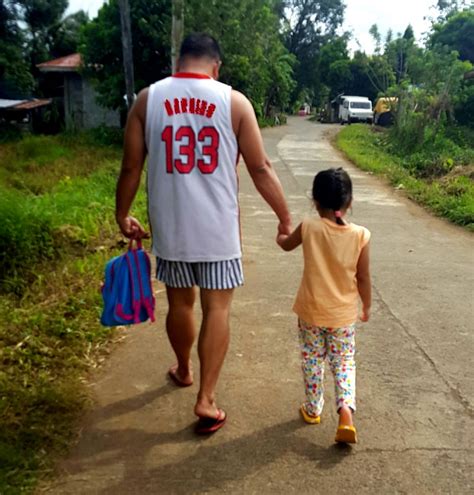 Filipina Mom Secretly Takes Pictures Of Husband And Daughter Holding