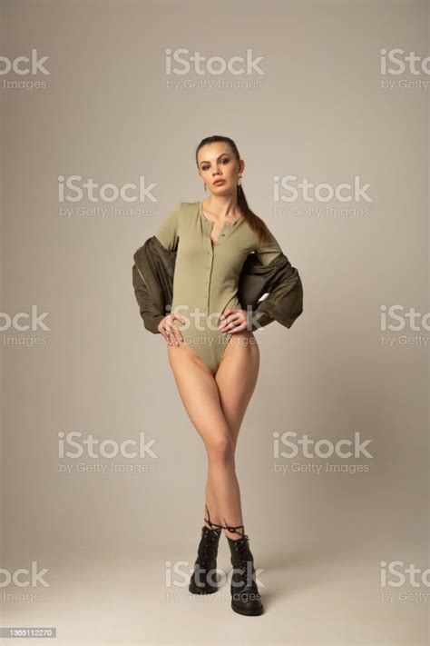 Young Slim Brunette Woman Fashion Posing Over White Background Stock