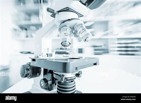 Science Microscope On Lab Bench Microbiology Laboratory Blue Toned