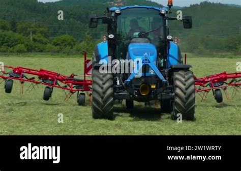 Two People Are Sitting Inside A Tractor When Making A Turn One Of