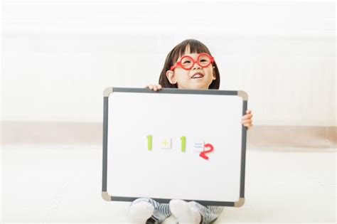 Premium Photo Cute Girl Playing With Toys