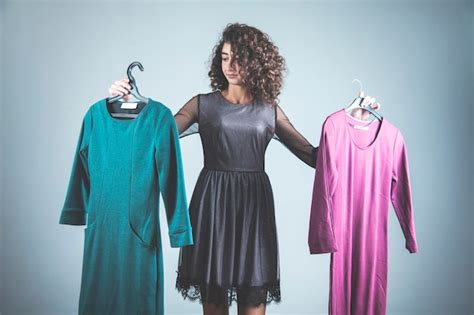 Premium Photo Woman Choose Dresses