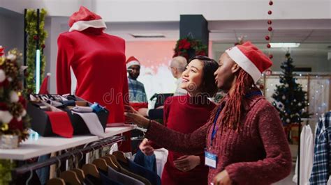 Retail Assistant Shows Client Garments Stock Footage Video Of Shopping Store 289333398