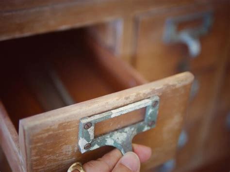 Premium Photo Close Up Of Person Hand Opening Drawer