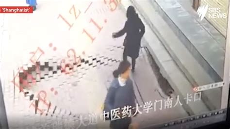 Woman Falls Into Sinkhole While Walking In China Caught On Camera Sbs