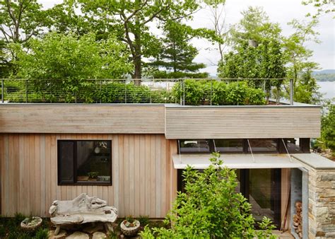 allee separates lakeside connecticut house into two distinct volumes