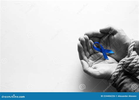 Slave With Tied Hands Holds Blue Ribbon Stop Slavery Human Trafficking