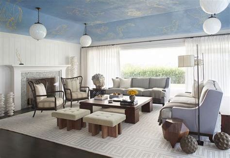 A Living Room Filled With Furniture And A Fire Place In Front Of A