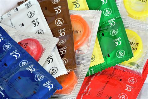 Assortment Of Coloured Condoms Photograph By Adam Hart Davisscience