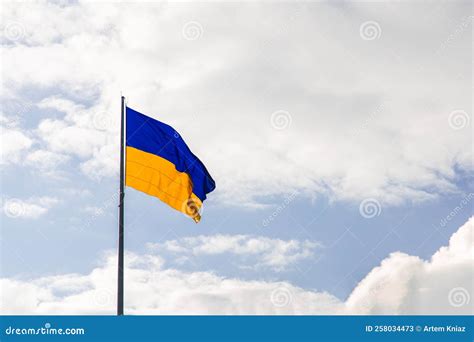 Ukrainian Flag Blowing On A Wind Bright Sky Background Simple Wallpaper