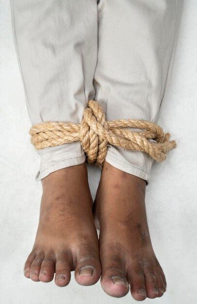 Premium Photo The Mans Legs Are Tied By Rope Violence Concept