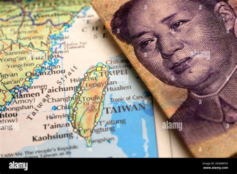 Close Up Of A Yuan Chinese Banknote On Top Of A Map Showing Taiwan