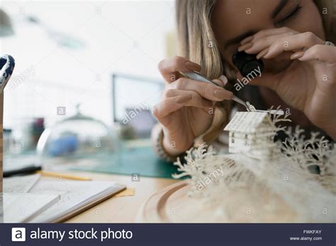 Craftswoman Using Loupe To Assemble Paper Diorama Stock Photo Alamy