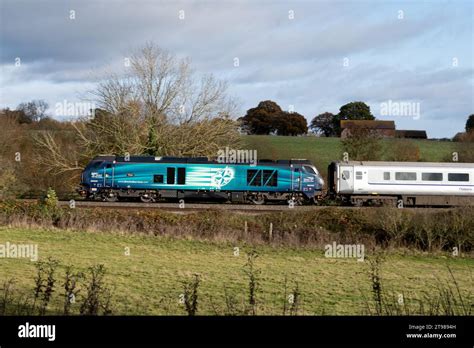 Direct Rail Services Class 68 Diesel Locomotive No 68009 Titan Pulling A Chiltern Railways