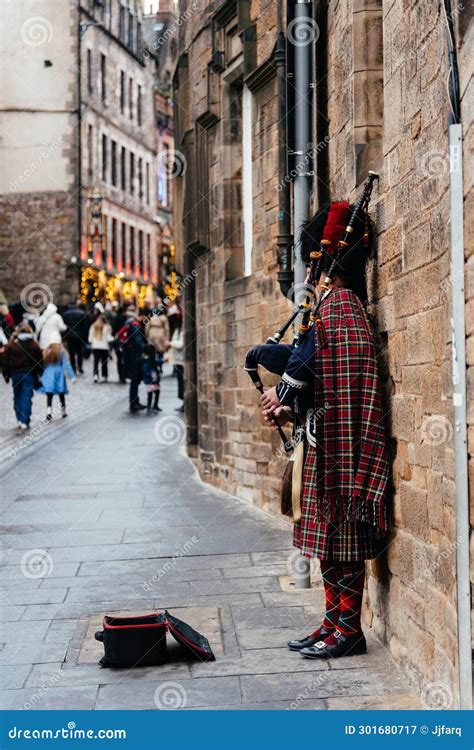 Bagpiper Playing Traditional Scottish Tunes At The Royal Mile In