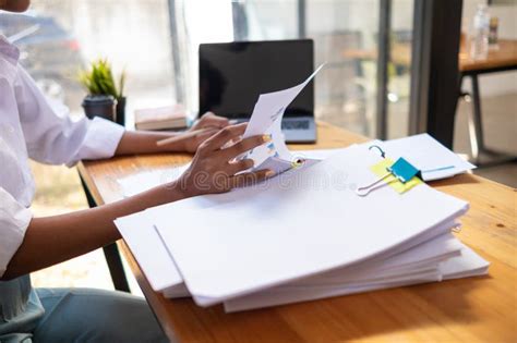 Businesswoman Hands Working On Stacks Of Paper Documents To Search And