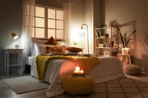Interior Of Bedroom With Cozy Blankets On Bed Burning Candles And
