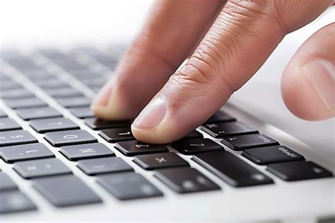 Fingers On A Laptop Keyboard Premium Ai Generated Image