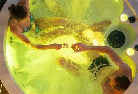 Couple Having Great Time Inside Their Garden Hot Tub Bath 24625716