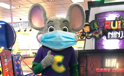Download Chuck E Cheese Mascot With Mask Wallpaper