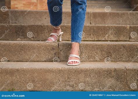 Woman Walking Down Stairs Wearing High Heels You Can See Her Feet Going Down The Steps Stock