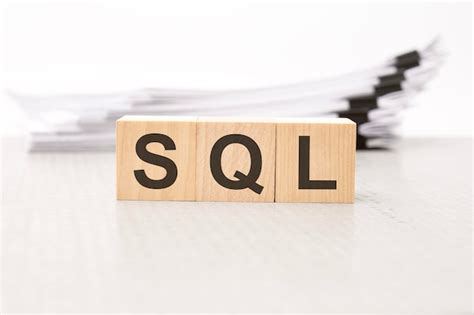 Premium Photo Sql Letters On Wooden Cubes The Background Is A White Business Papers Finance