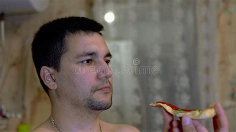 Untidy Unshaven Man Bites A Slice Of Lemon And Juice Flows From His