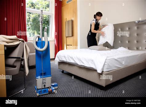 Hotel Room Service House Keeping At Work In A Hotel Room Cleaning Up