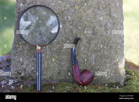 Magnifying Glass And Pipe On The Grave Of Sir Arthur Conan Doyle In All