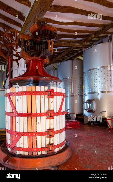 Press And Stainless Steel Fermentation Tanks Vessels In Winery Stock