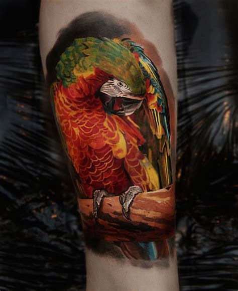 Vivid Parrot Tattoo On Guys Arm