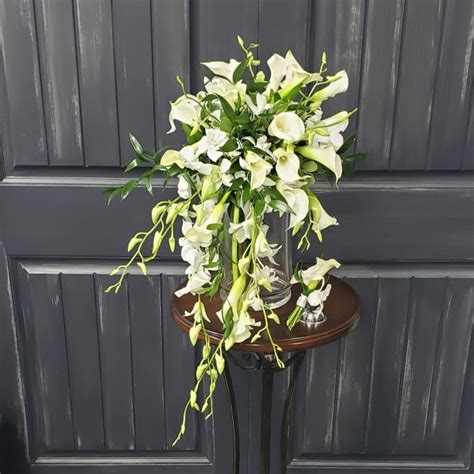 Calla Lily And Dendrobium Cascade Bouquet And Boutonniere Flower