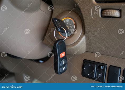 Car Key In Ignition Start Stop Or Accelerate Engine Car Shape Keyfob On Vehicle Dashboard